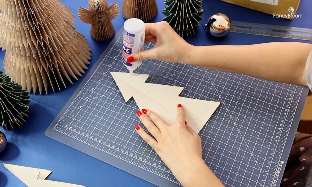 How To Make A Christmas Tree Out Of Paper (DIY West Elm Dupe) - FancyBloom